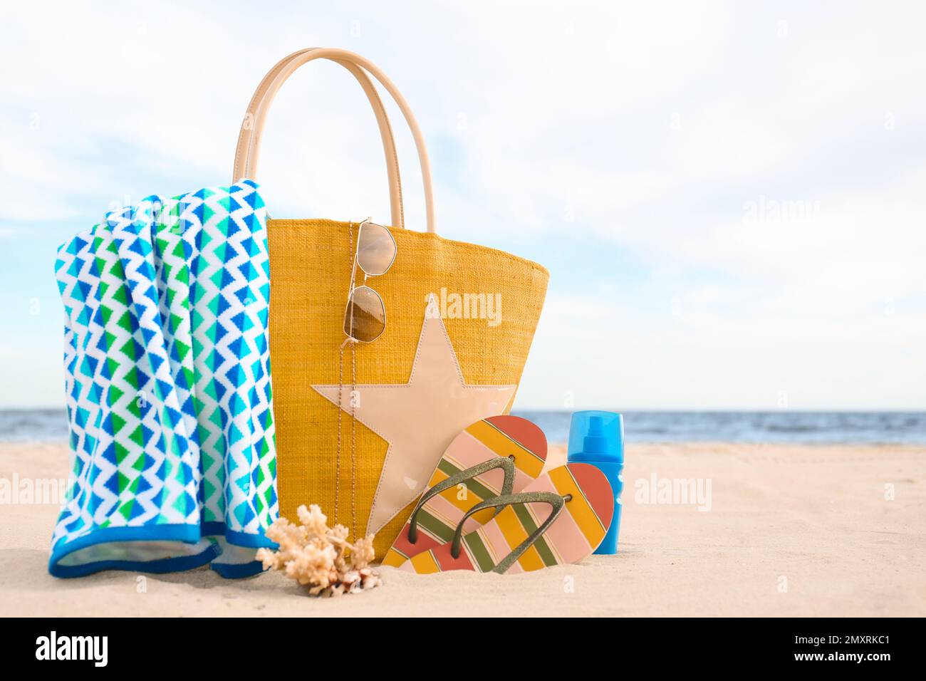 Different stylish beach objects and coral on sand near sea Stock Photo ...