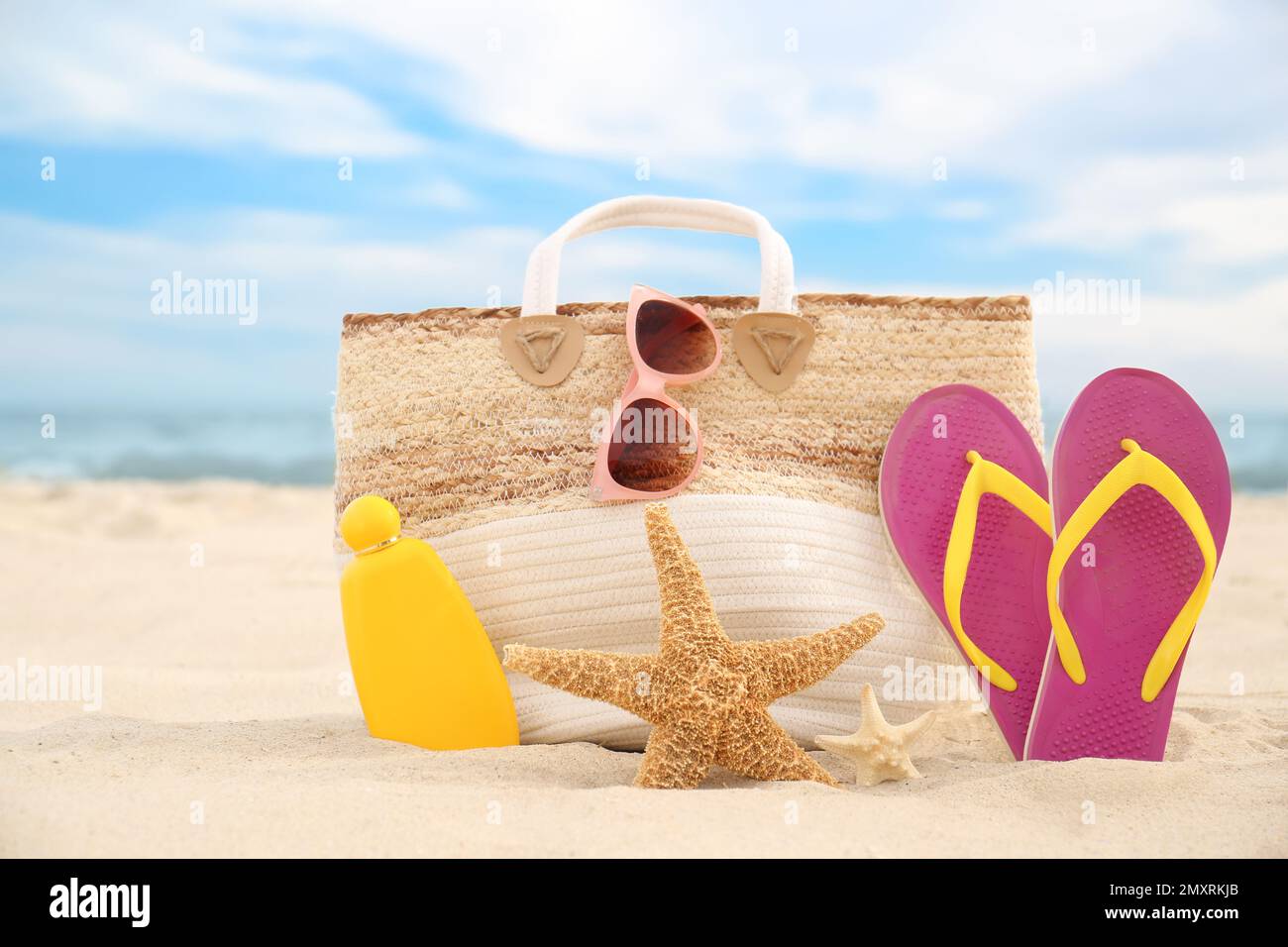 Different stylish beach objects and starfishes on sand near sea Stock ...
