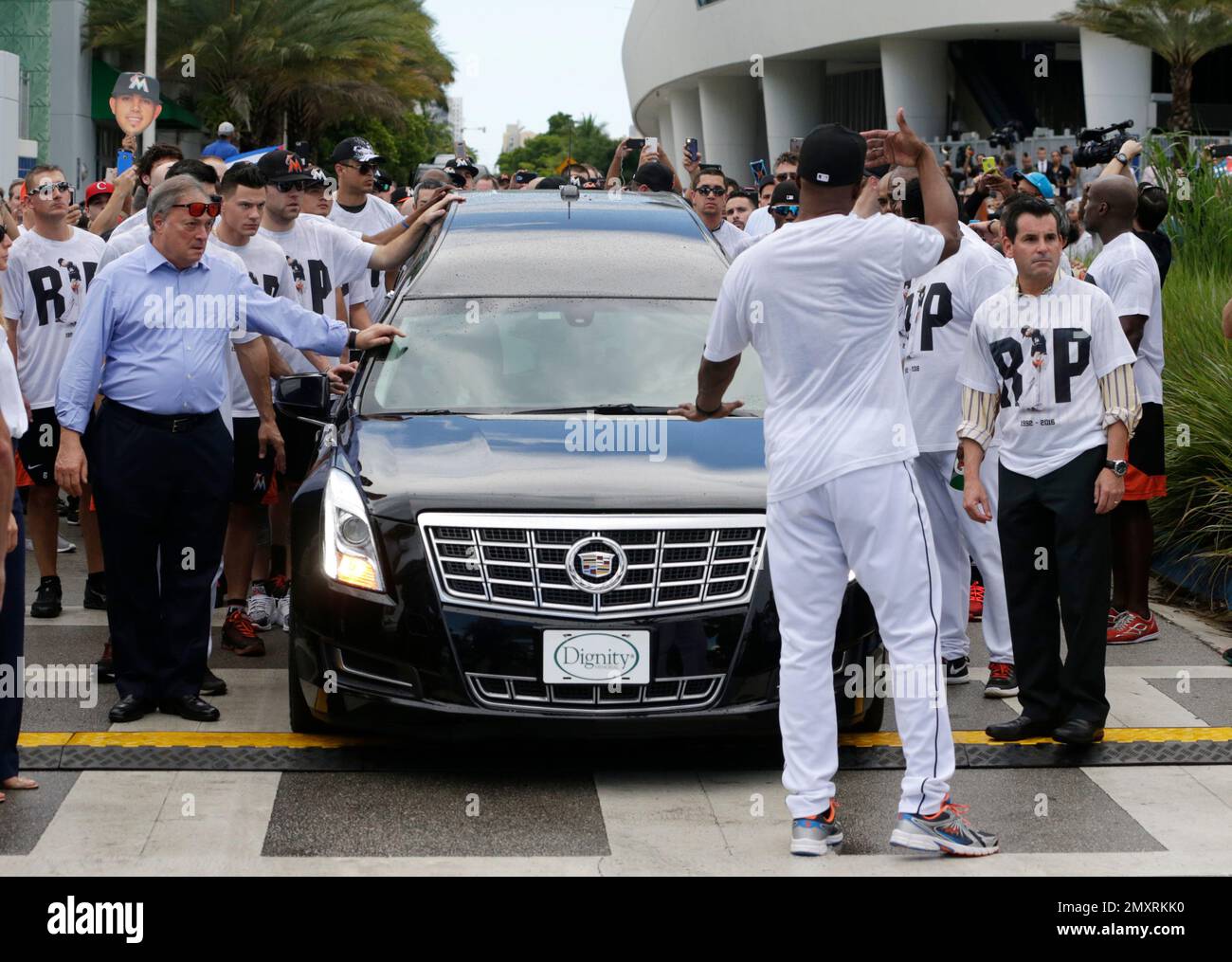 Miami Marlins owner and CEO Jeffrey Loria, left holding fender, and ...