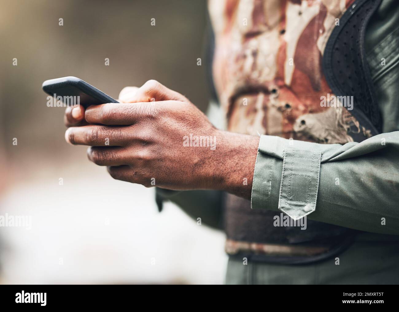 Phone, camouflage and solider at war on social media or browsing ...