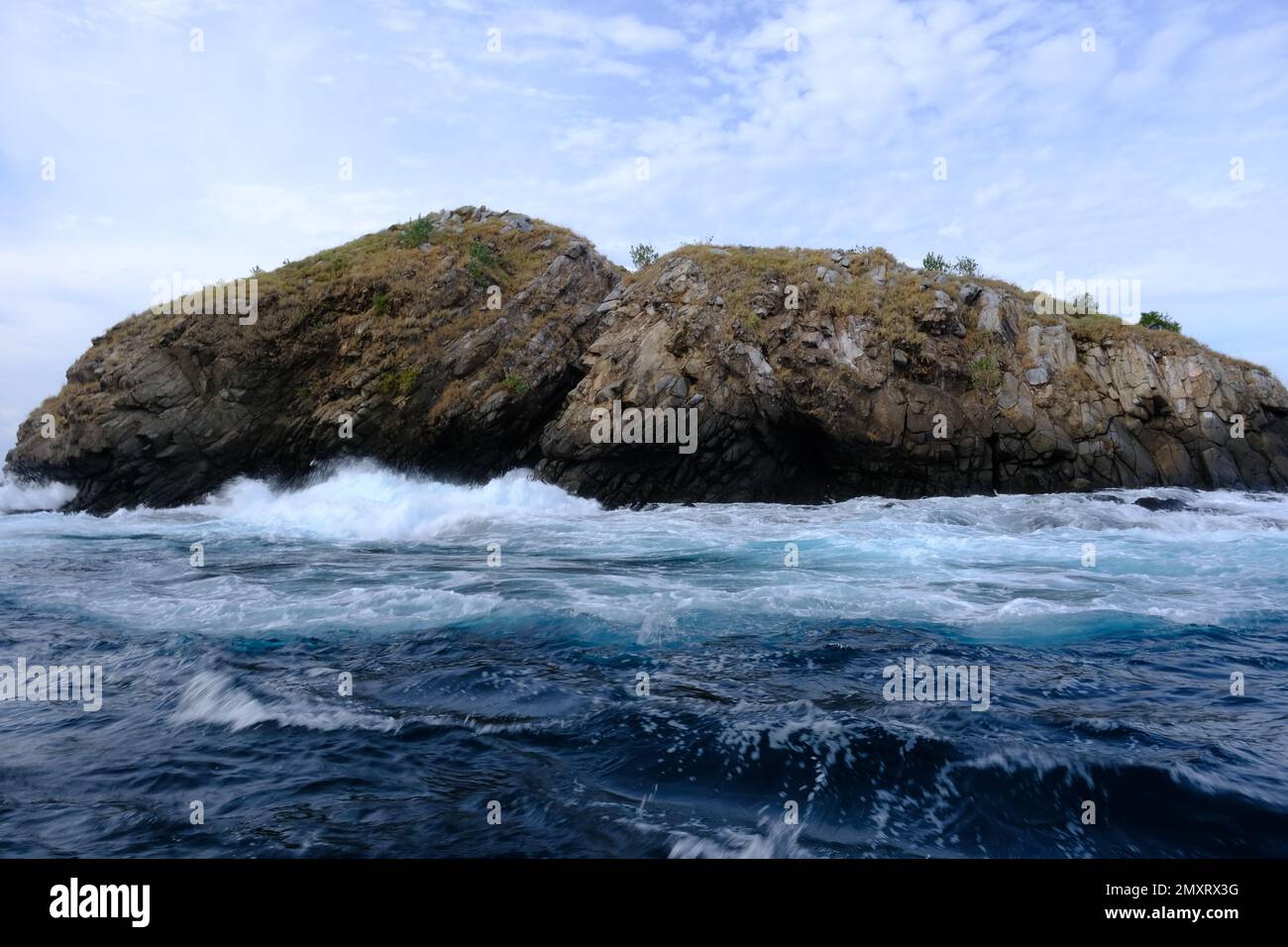 Indonesia Sumbawa - Small island in rough sea Stock Photo - Alamy