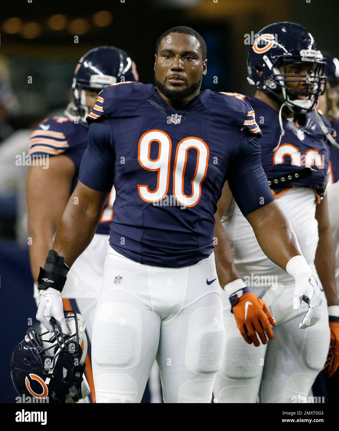 Chicago Bears defensive end Cornelius Washington stands on the field ...