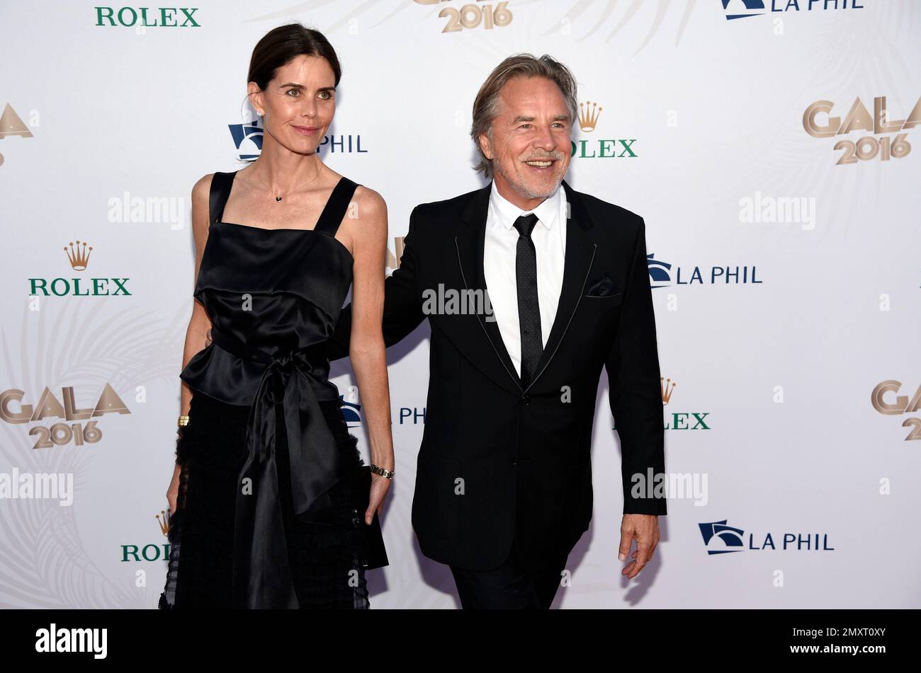 Actor Don Johnson, right, poses with his wife Kelley Phleger at the Los ...