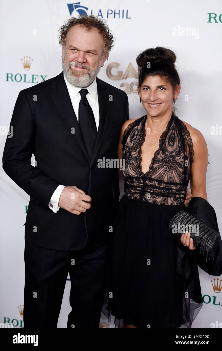 Actor John C. Reilly and his wife Alison Dickey pose together at the ...