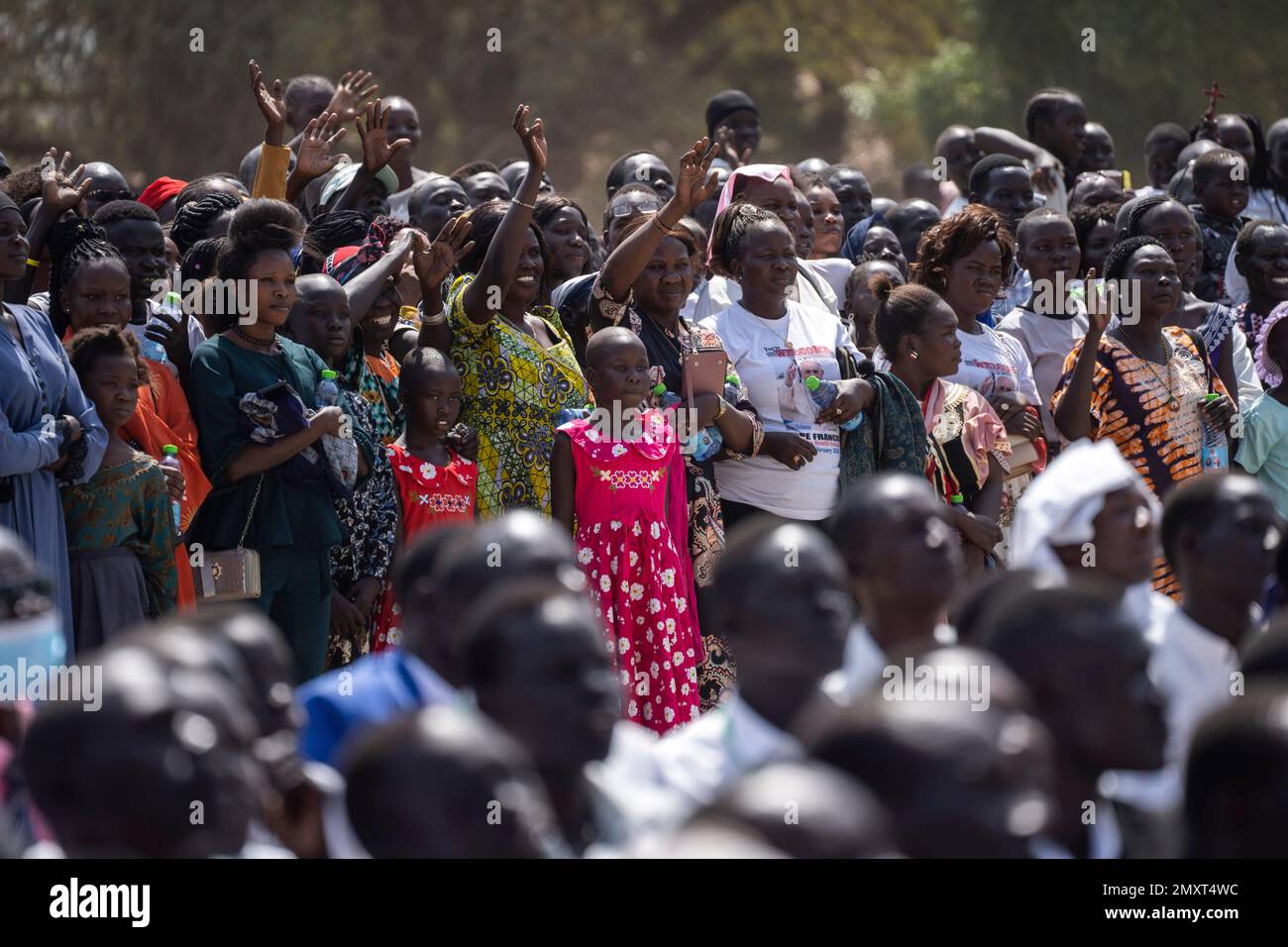 People wave as Pope Francis prepares to leave the St. Theresa Cathedral ...