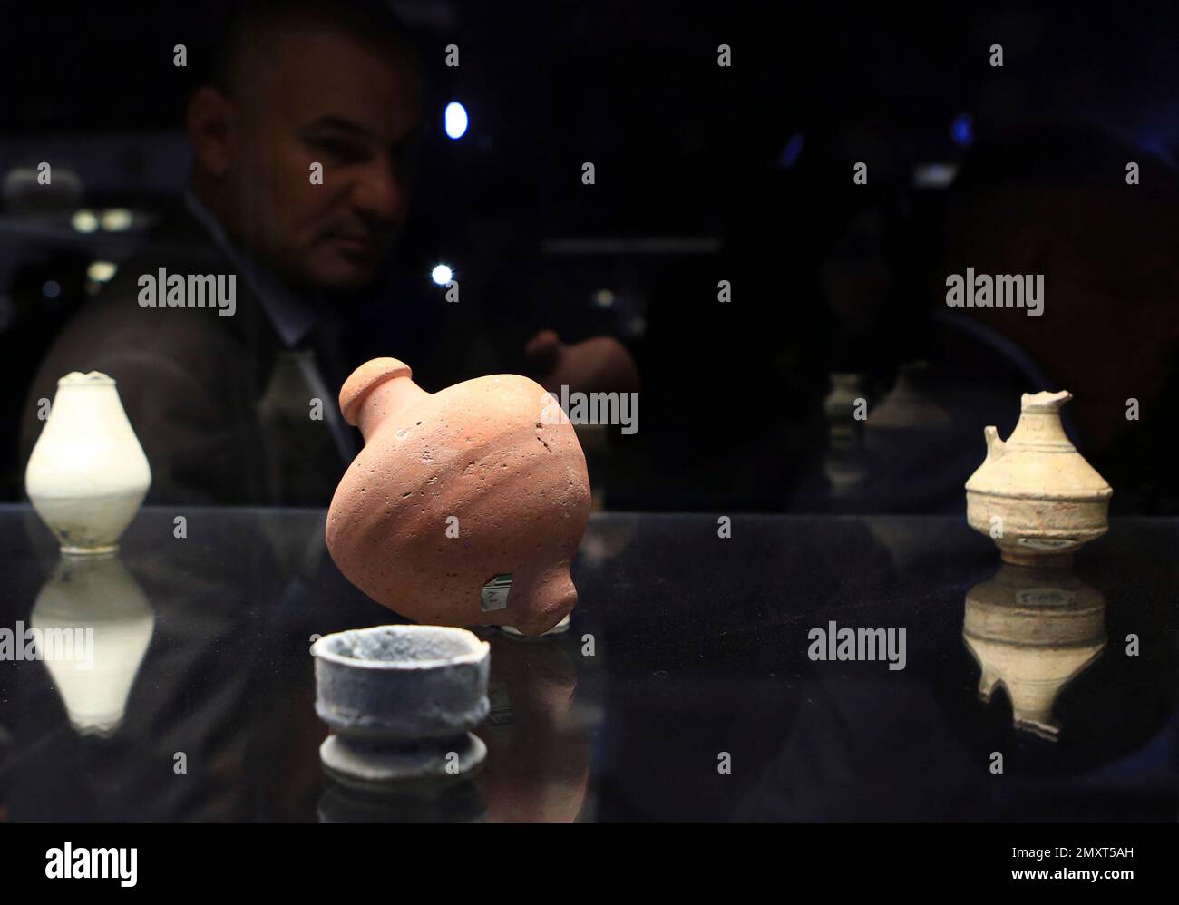 Antiquities are displayed at a newly opened museum in the southern city ...