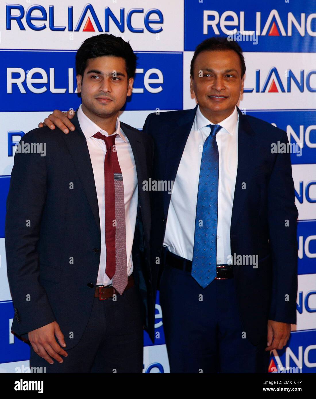 Chairman of Reliance Group Anil Ambani, right, stands with his son Jai ...