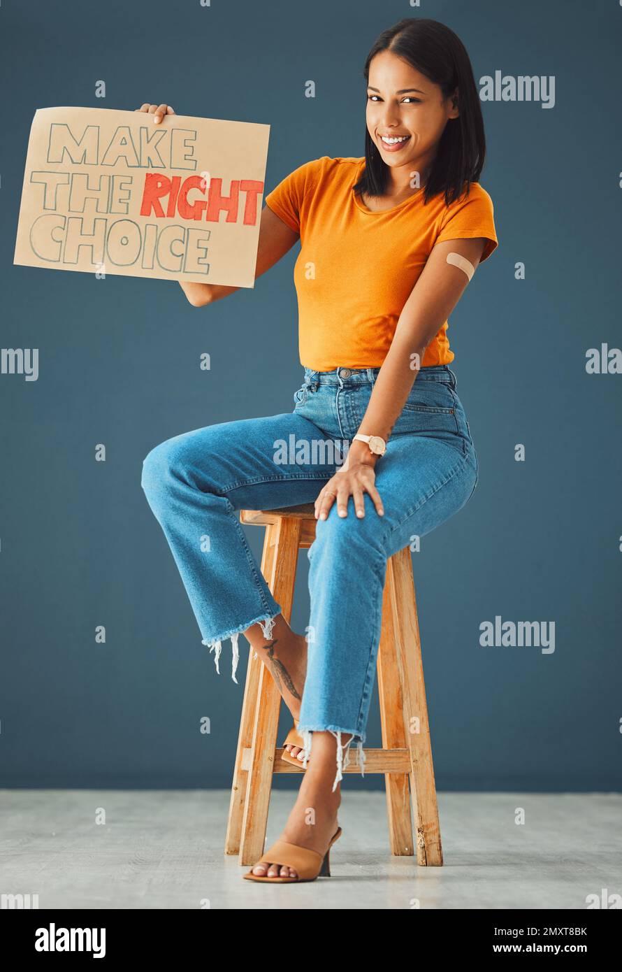 Woman, vaccine poster and studio portrait with smile, stop covid and ...