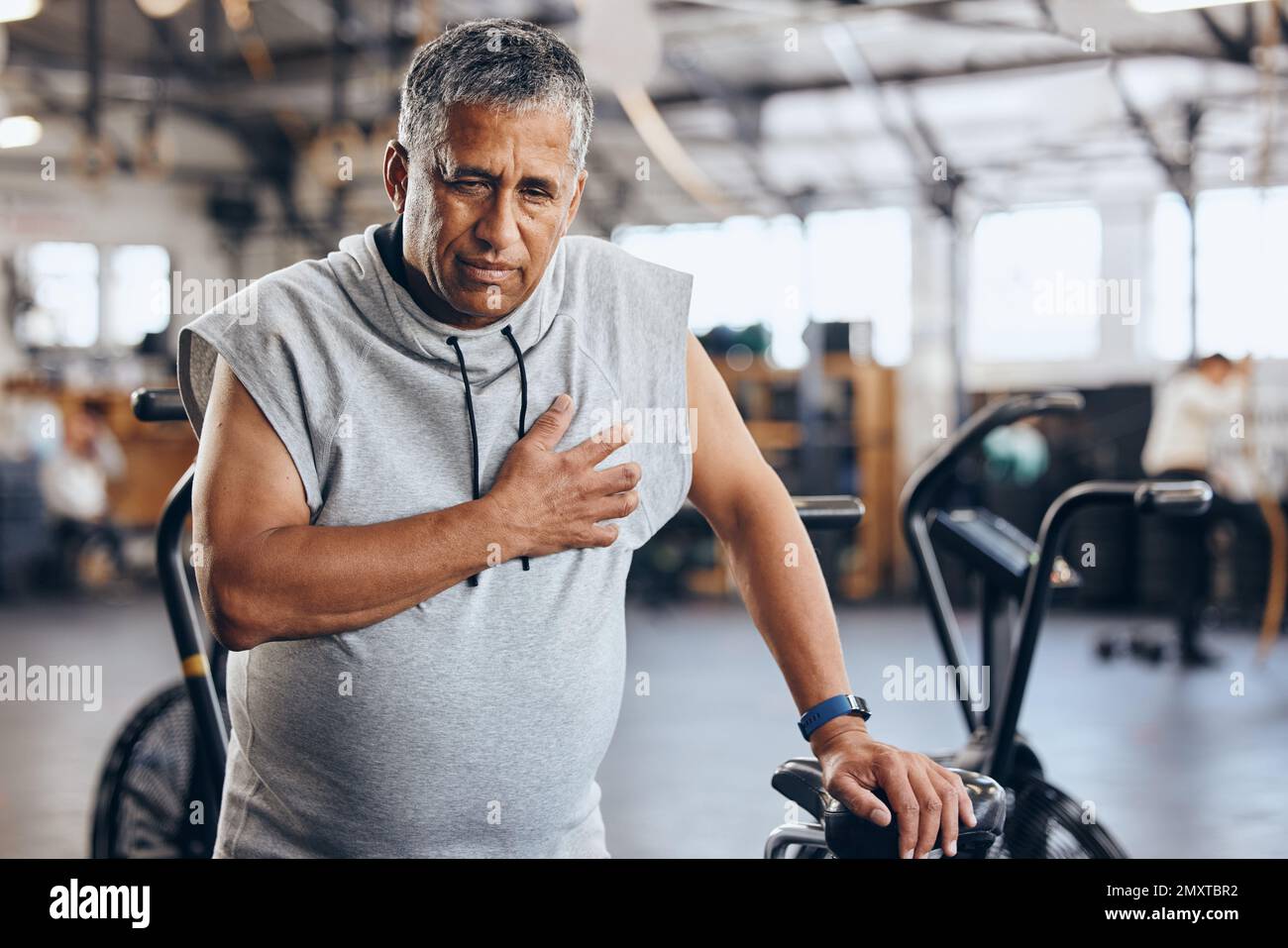 Gym, pain in chest and senior man with medical emergency during sports ...
