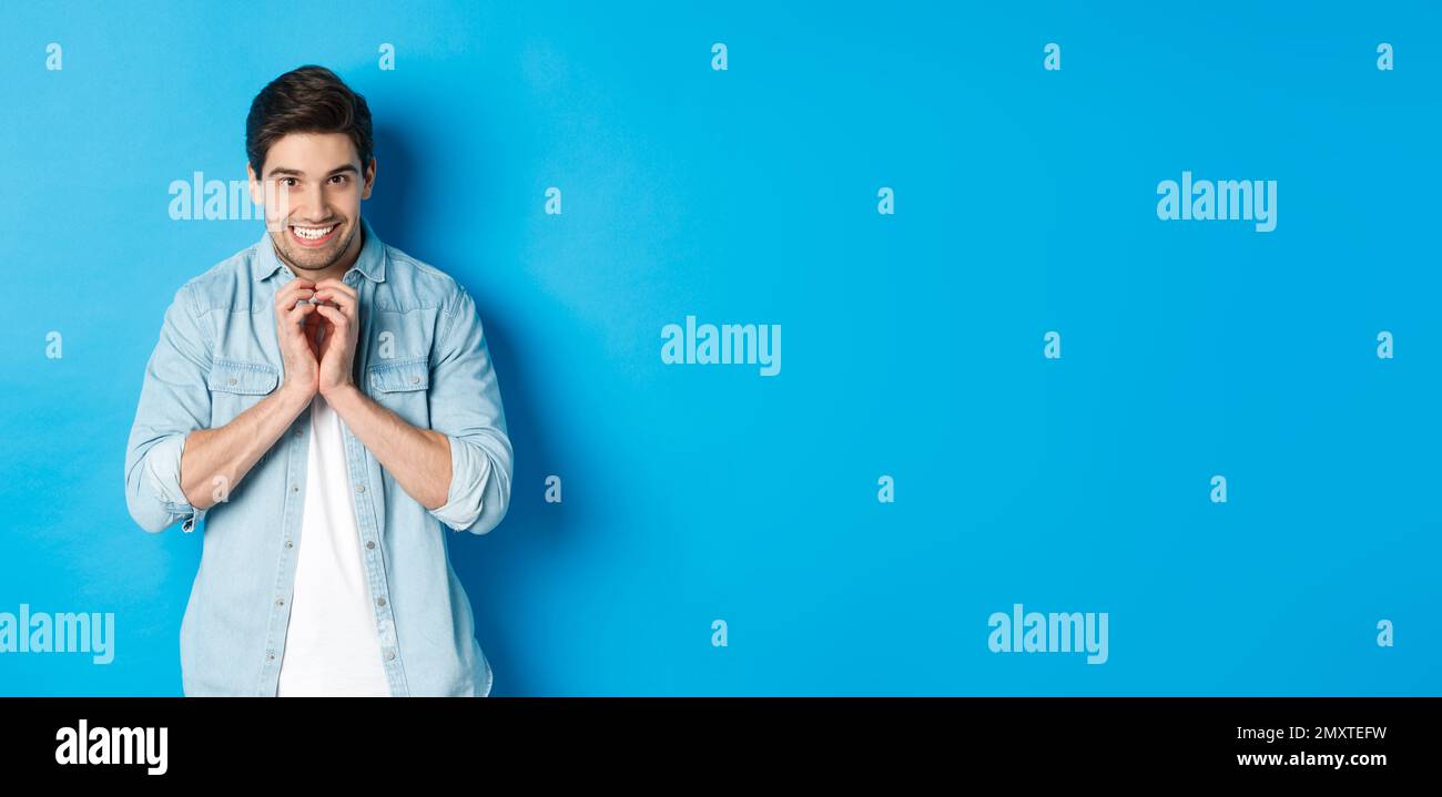 Funny cunning man having evil plan, scheming something and smiling ...