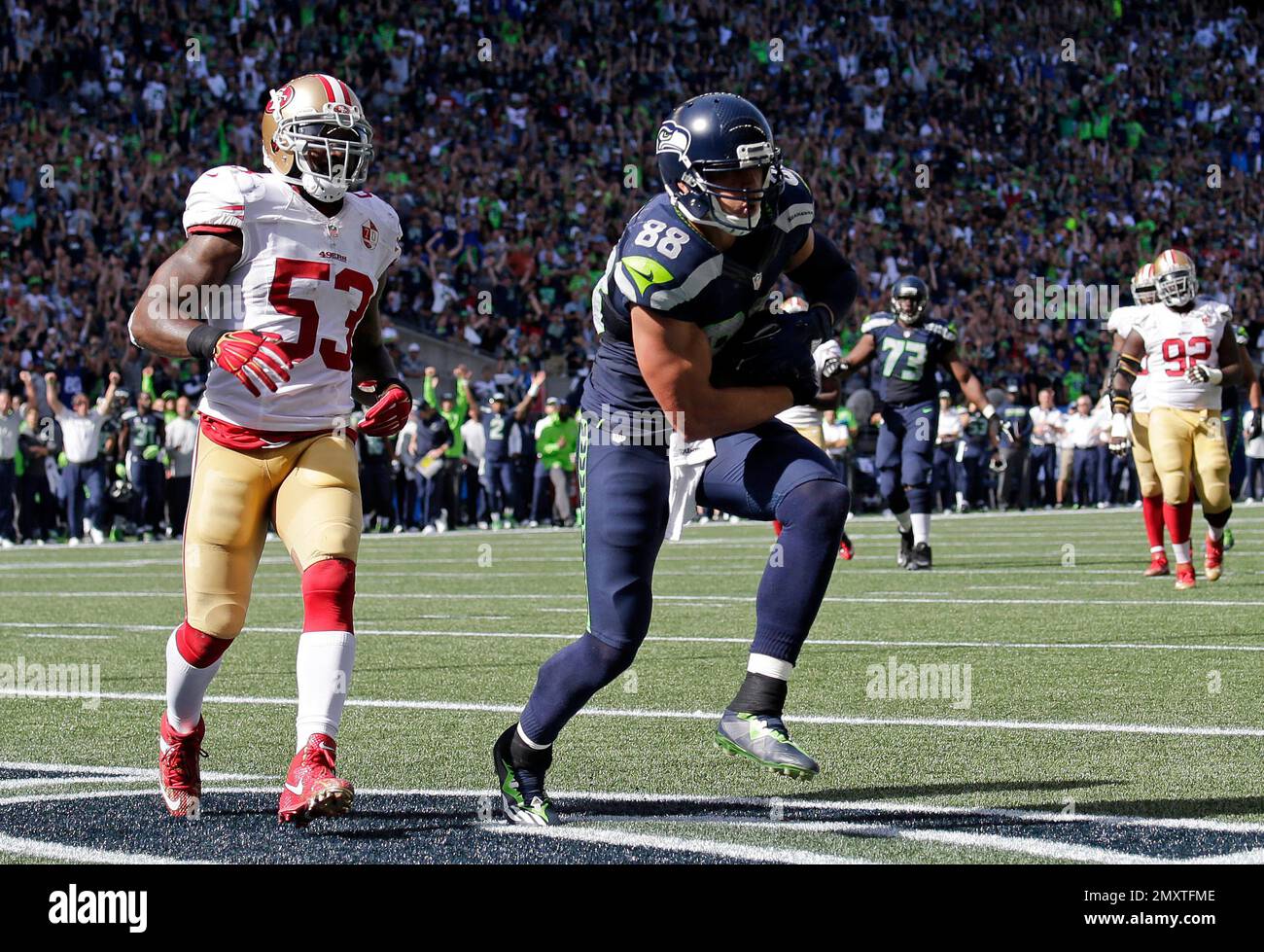 Seattle Seahawks' Jimmy Graham (88) scores a touchdown in front of San ...