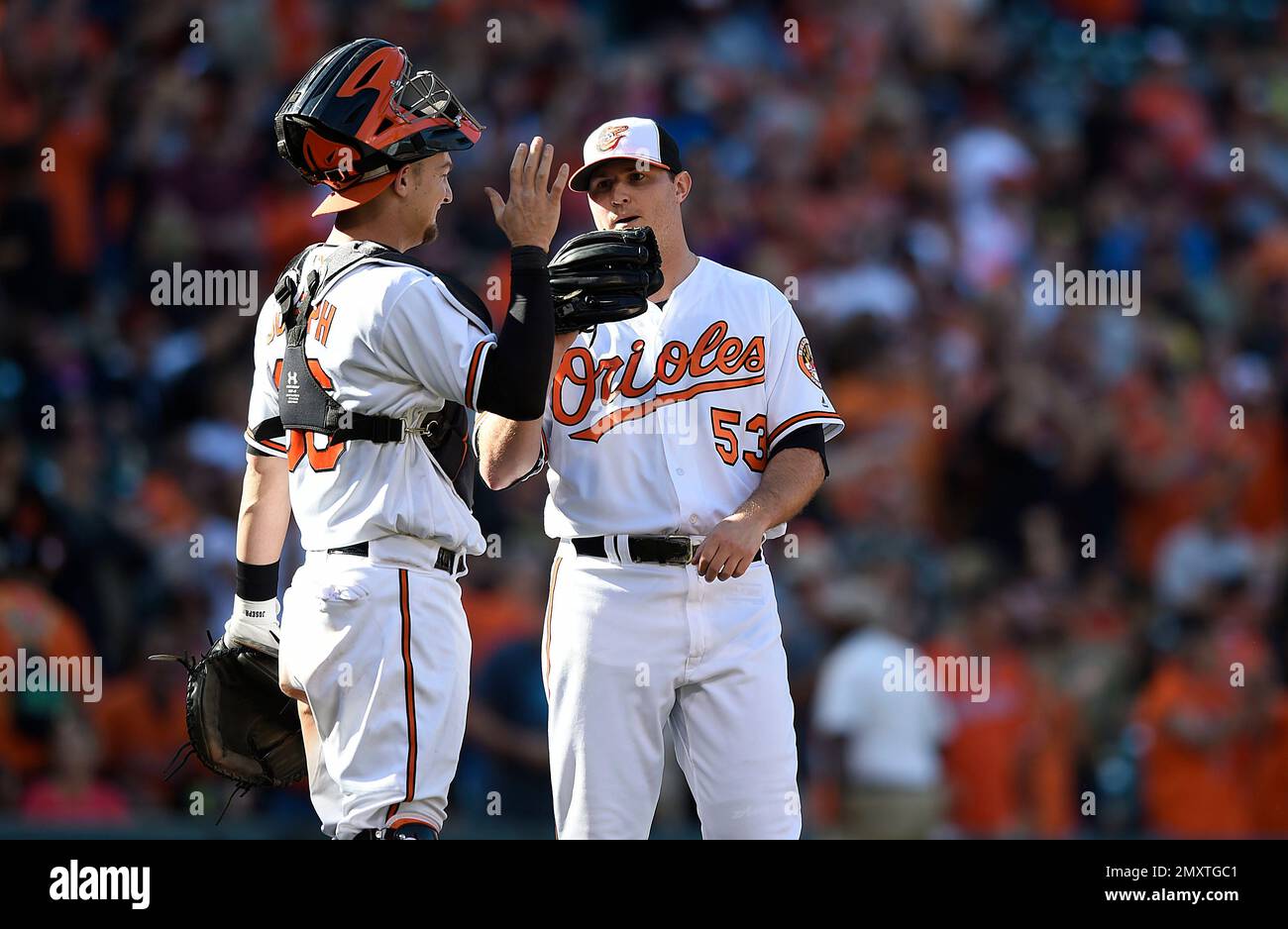 Baltimore Orioles catcher, Caleb Joseph, left, and pitcher Zach Britton ...