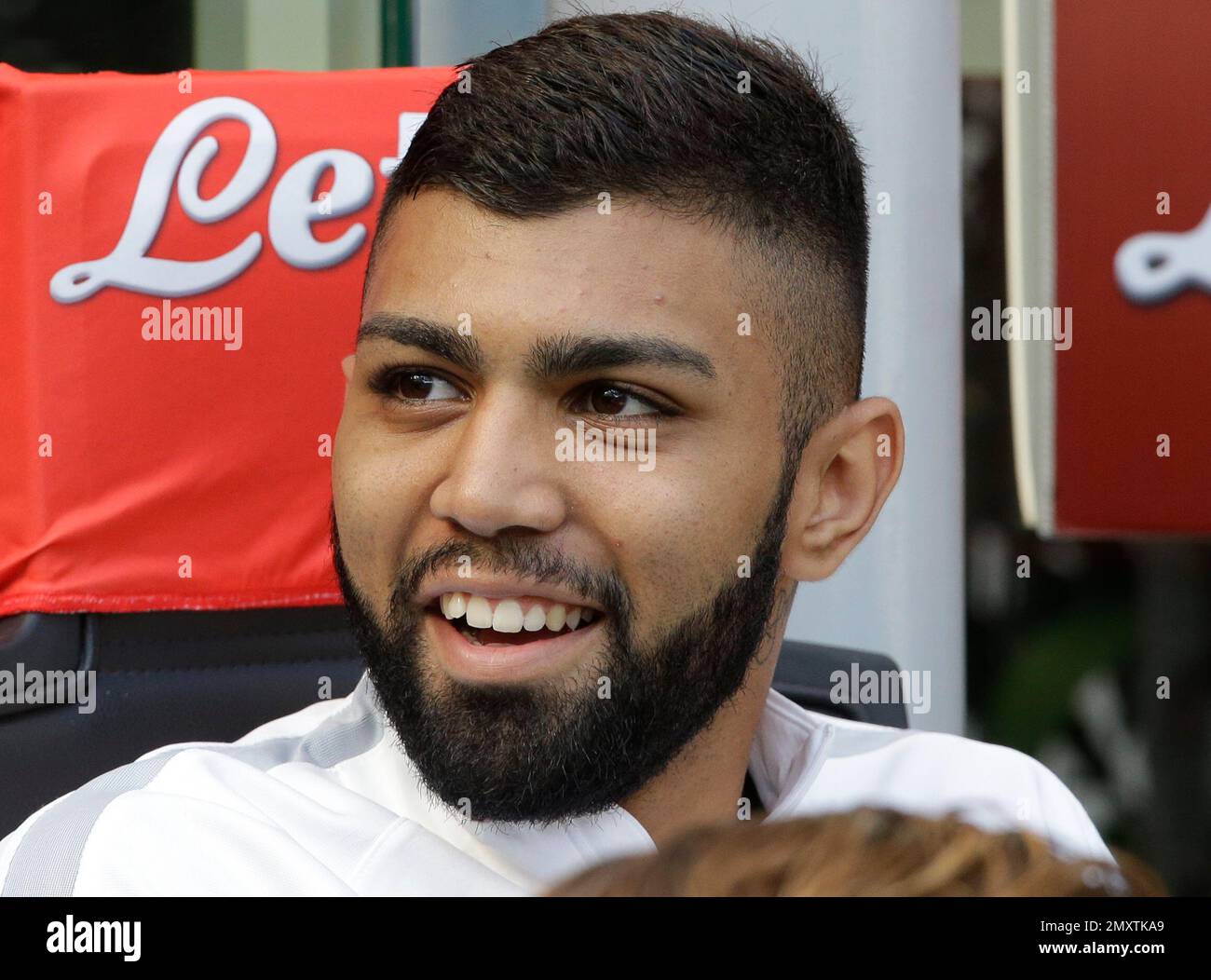 Inter Milan's Gabriel Barbosa smiles as he sits on the bench prior to ...