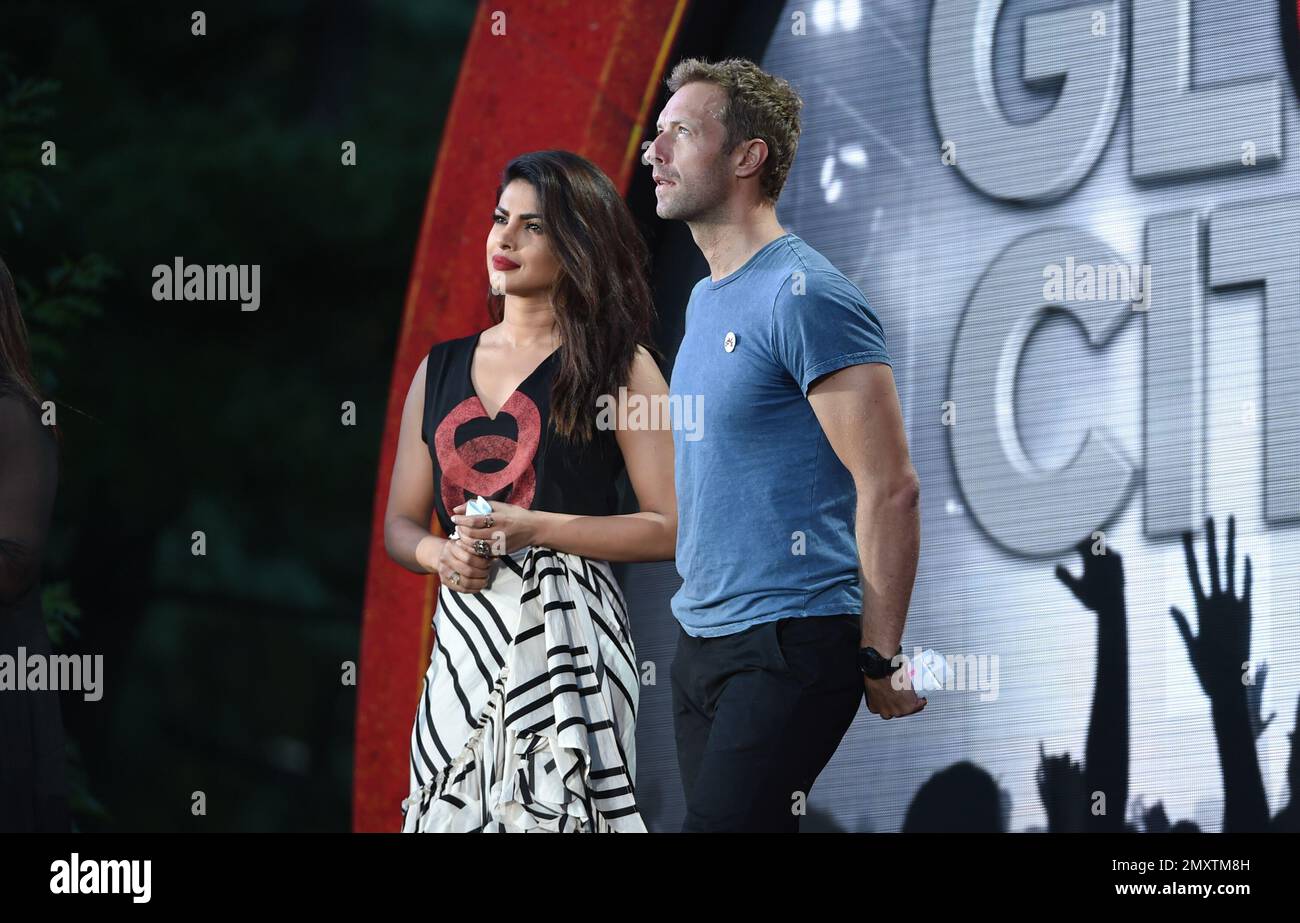 Actress Priyanka Chopra, left, and musician Chris Martin speak at the ...