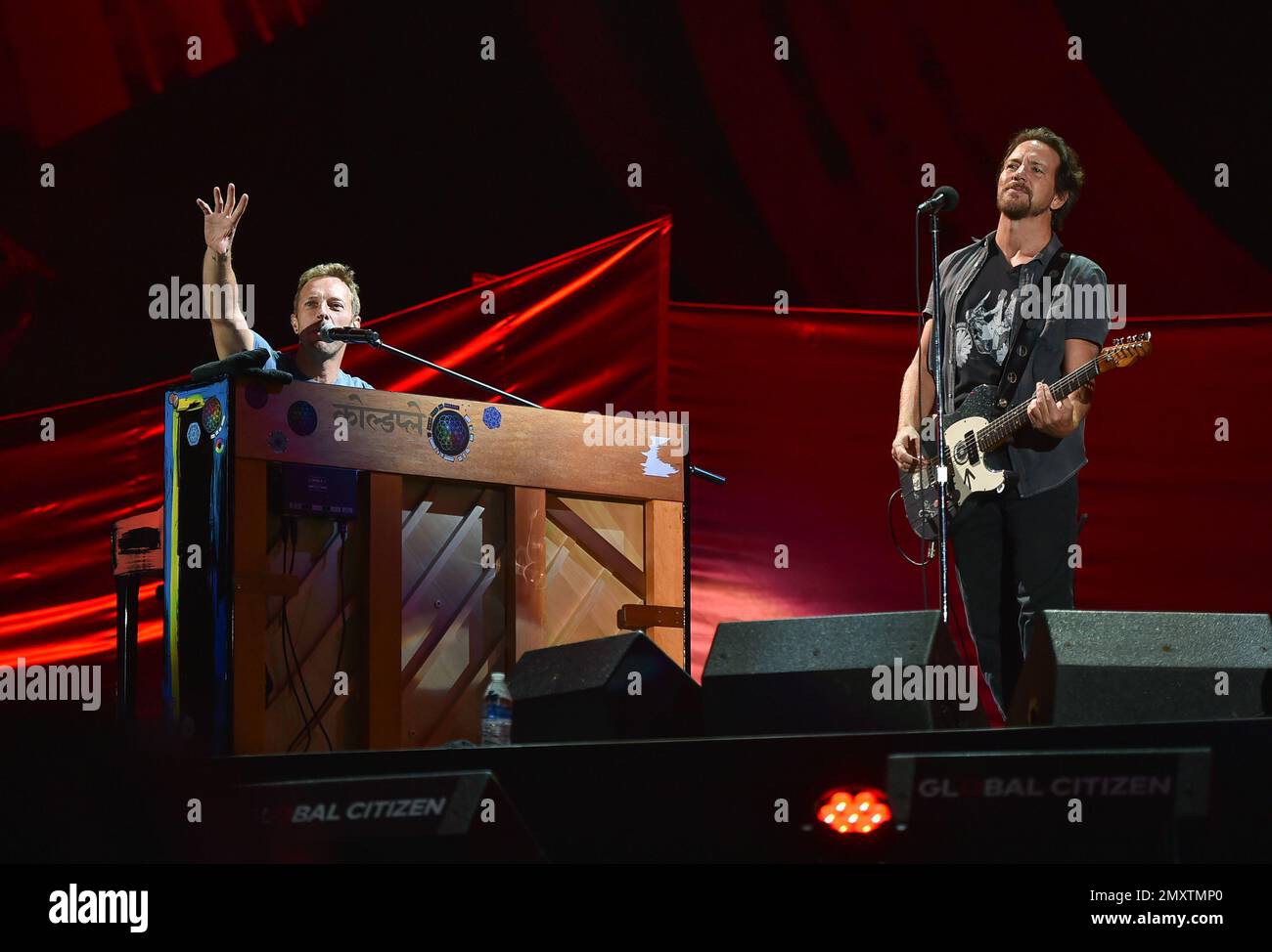 Musicians Chris Martin, left, and Eddie Vedder perform together at the ...