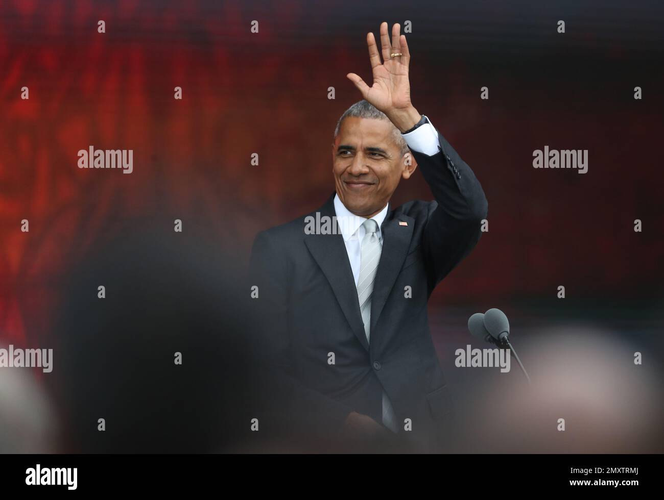 President Barack Obama waves during the opening ceremony of the ...