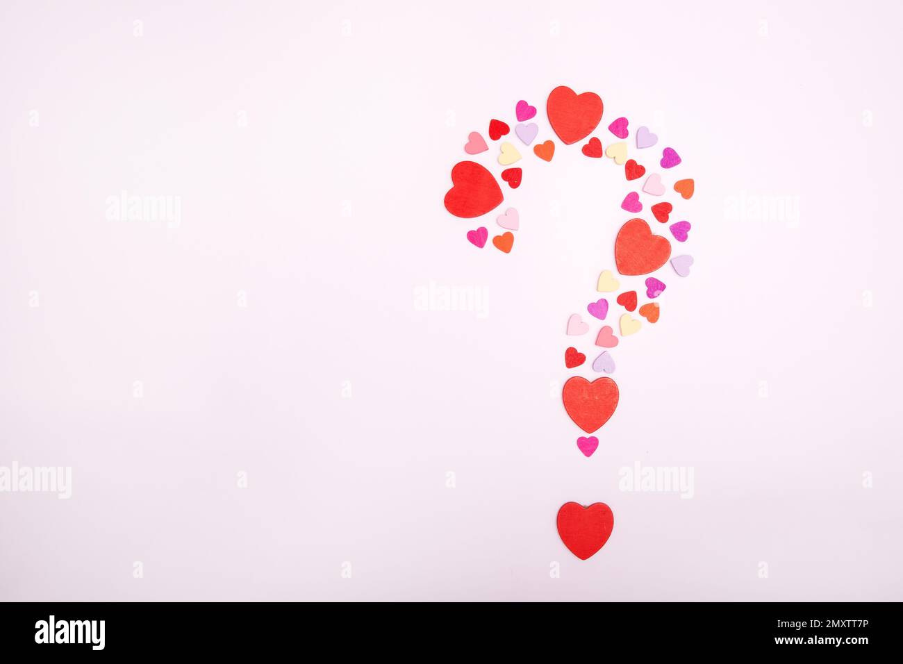 Question symbol made from hearts on a gray background. Marriage ...