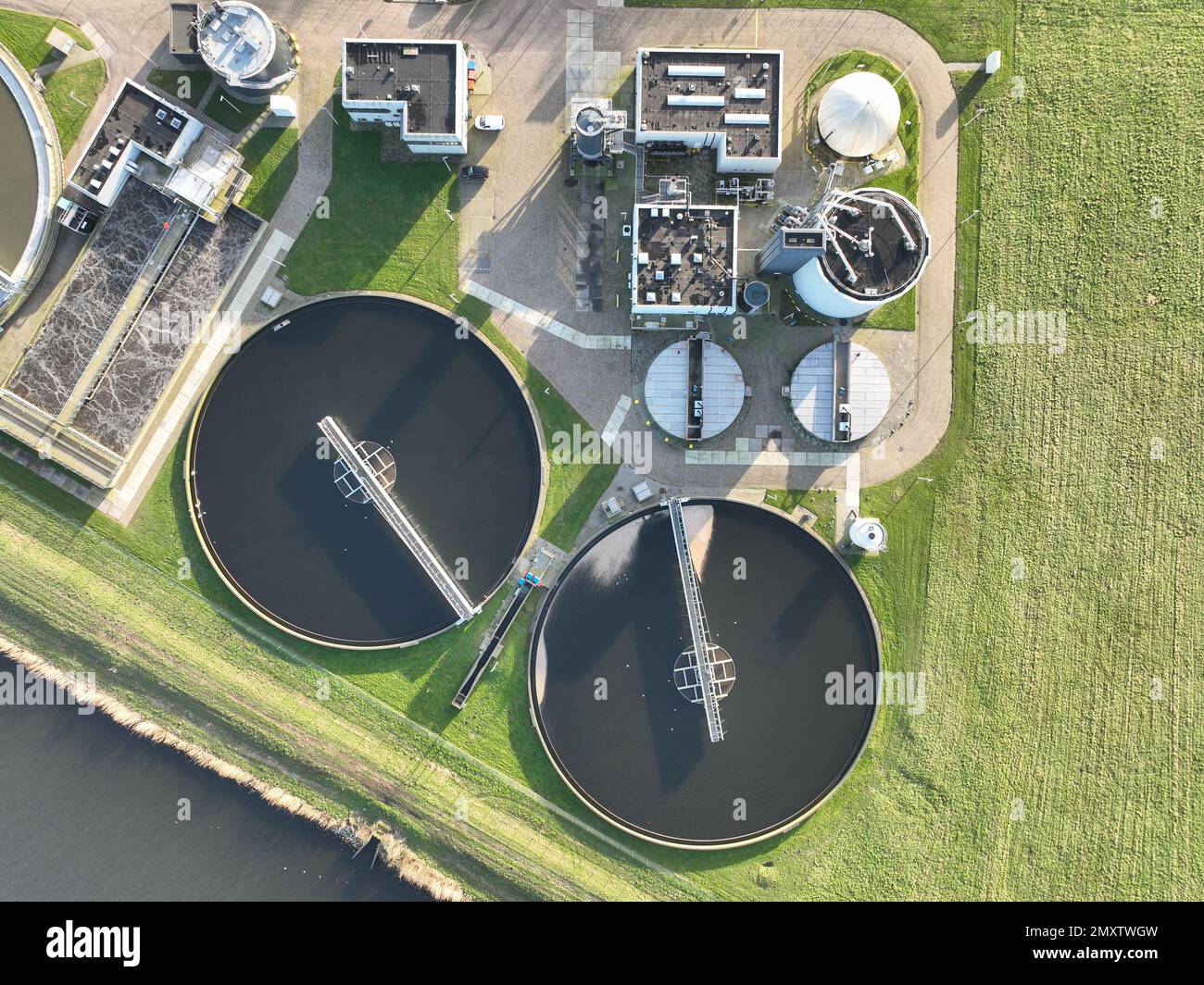A top-down perspective of a waste water treatment plant provides a ...