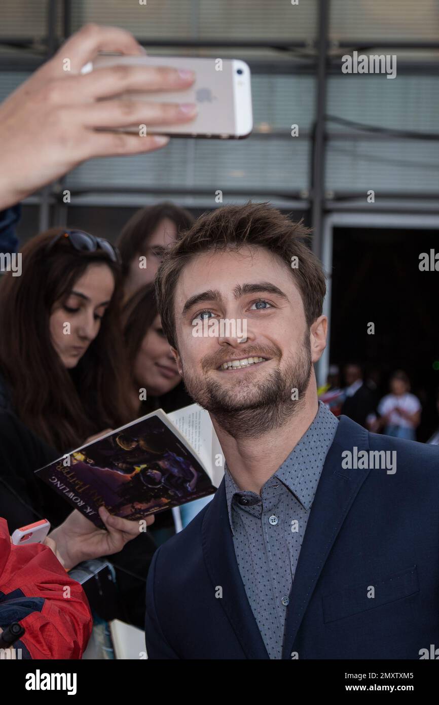 Daniel Radcliffe poses for pictures with fans upon arrival at the ...