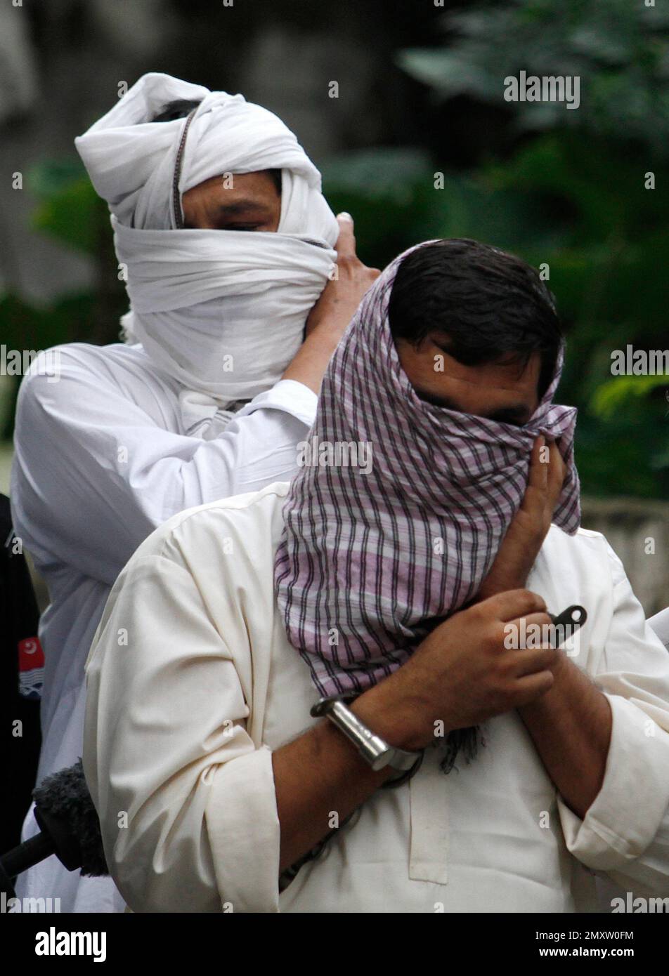 Ex-husband Muhammad Shakeel, front, and father Muhammad Shahid of slain ...