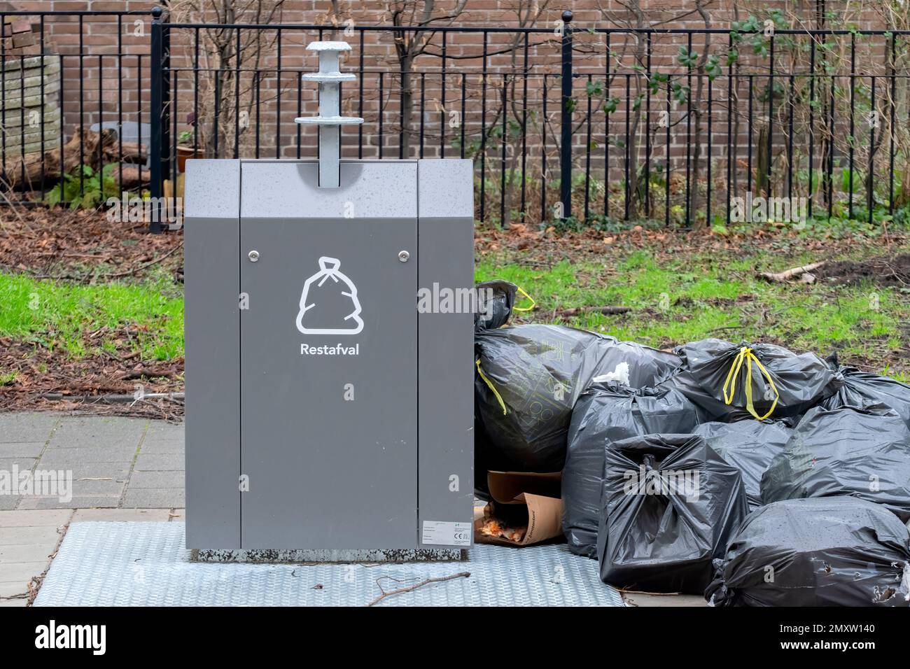 Garbage Bags Aside A Container At Amsterdam The Netherlands 2-2-2023 ...