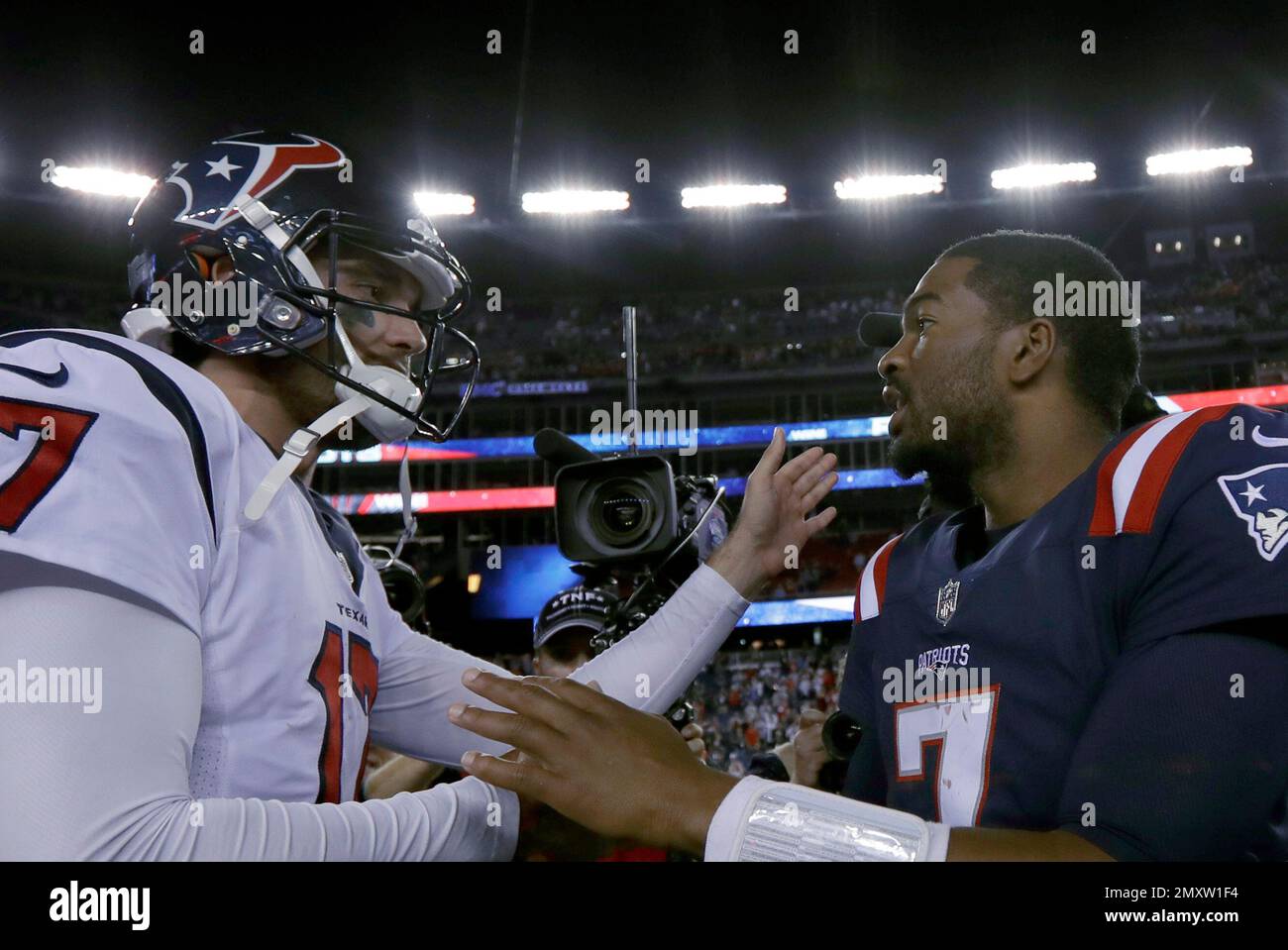 Houston Texans quarterback Brock Osweiler, left, and New England ...