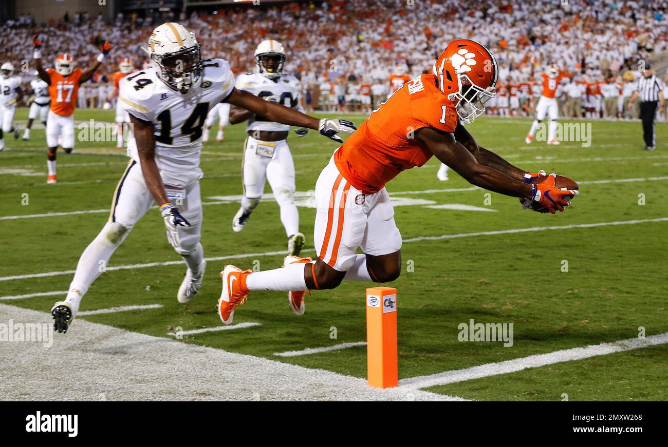 Clemson wide receiver Trevion Thompson (1) is pushed out of bounds by ...