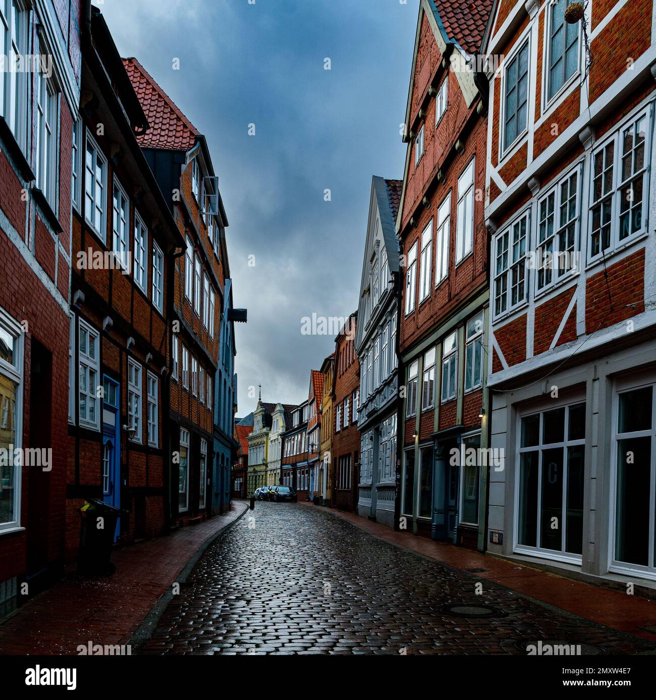 An empty street in a town with brick houses under a gloomy sky Stock ...