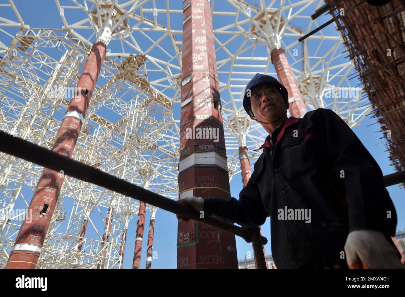 A worker is pictured in the Grand Mosque of Algiers under construction ...