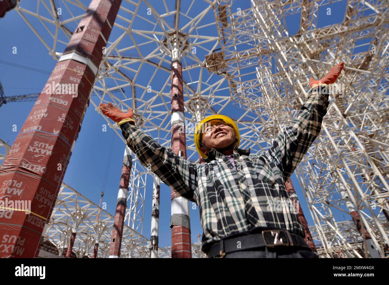 A worker is pictured in the Grand Mosque of Algiers under construction ...