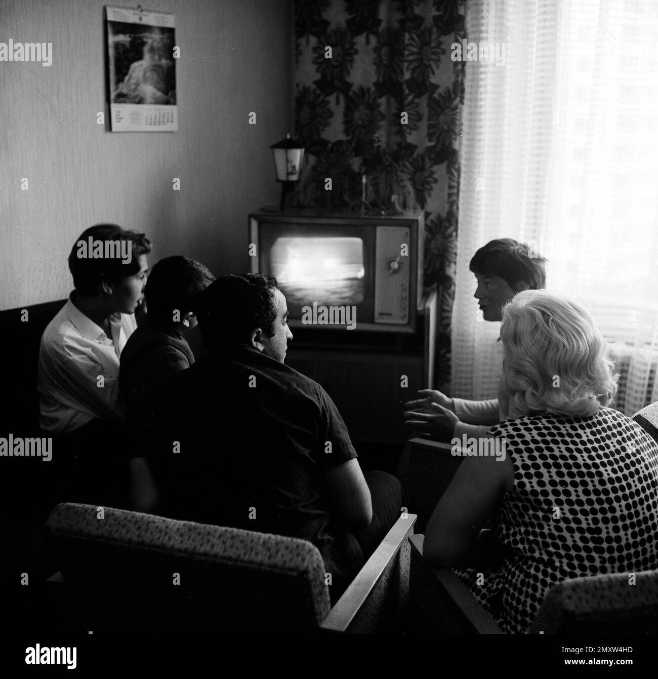 A family in Moscow, Russia, watch brief taped excerpts on Soviet ...