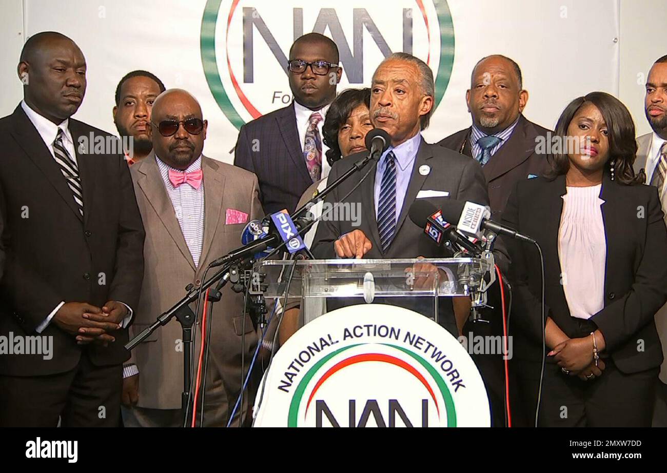 In this image taken from video, The Rev. Al Sharpton, center, speaks to ...