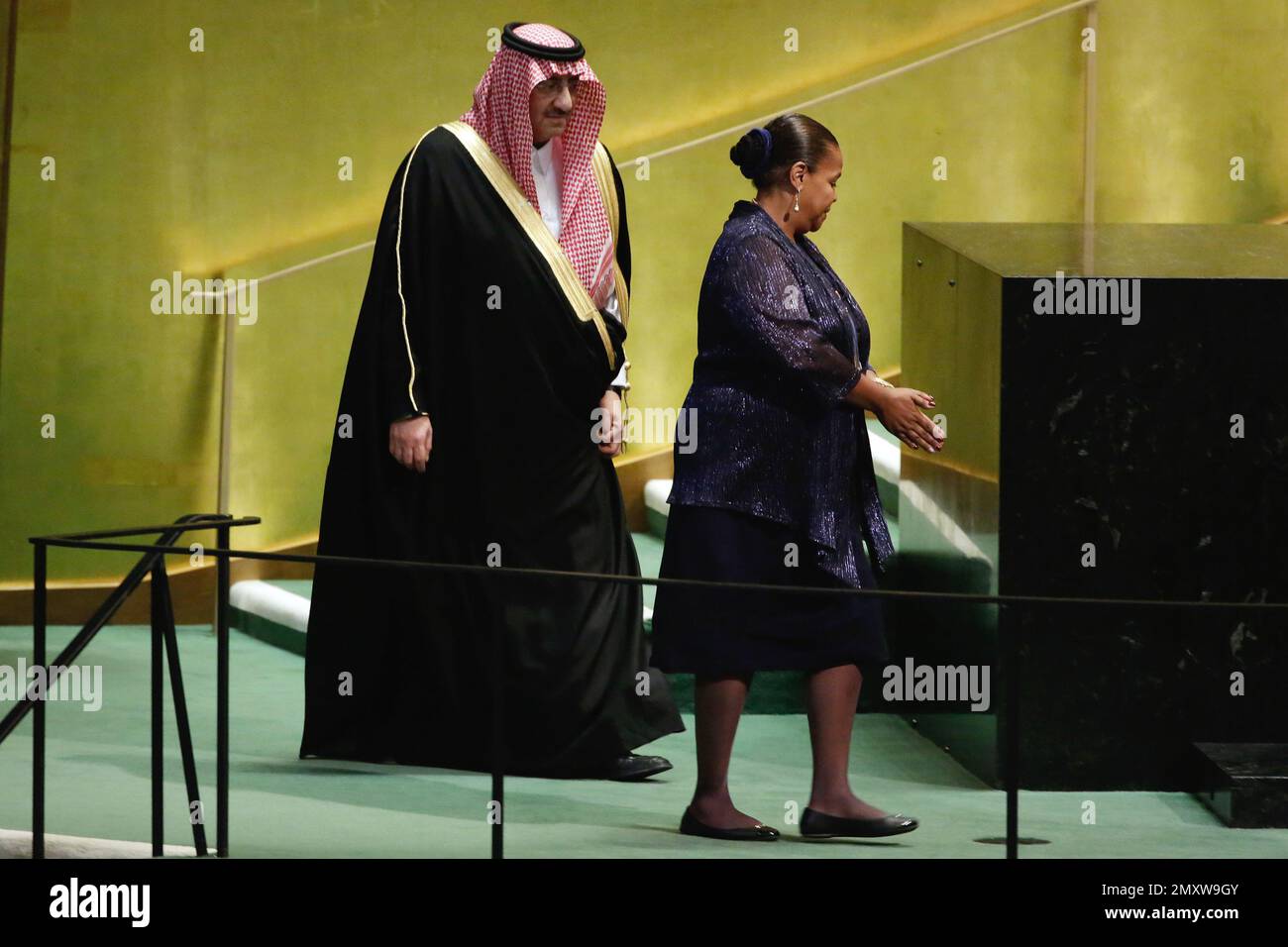Saudi Crown Prince Mohammed bin Nayef is escorted to the podium to ...
