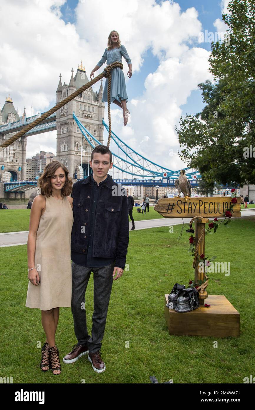 Actors Ella Purnell, left, and Asa Butterfield pose for photographers ...