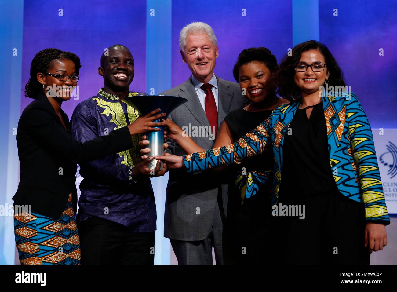IMAGE DISTRIBUTED FOR HULT PRIZE FOUNDATION - Former US President Bill Clinton (center) stands ...