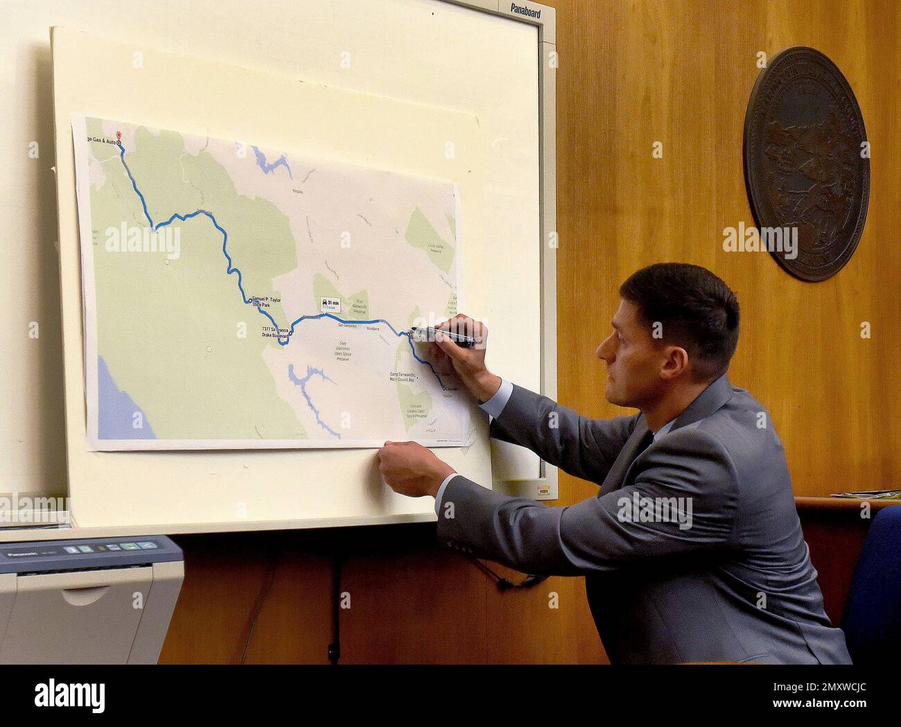 Marin County Sheriff's Detective Scott Buer marks the location of the ...