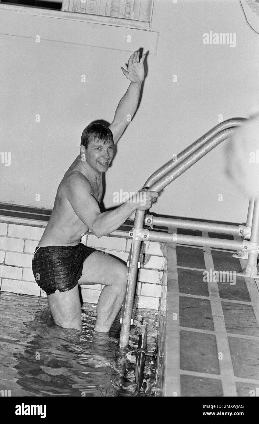 Emerging from the pool after a dive is Charles Percy, Republican ...