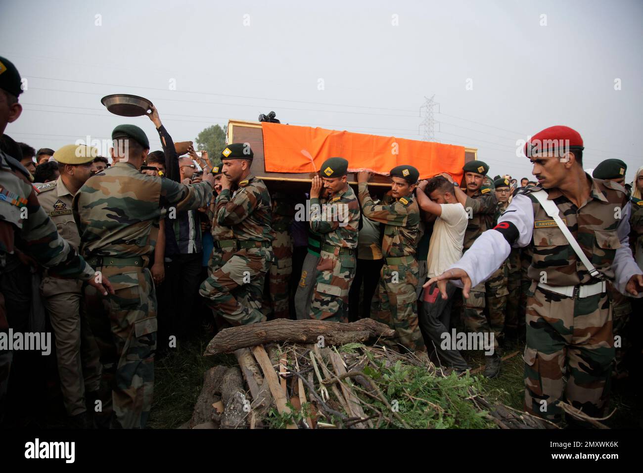 Indian army soldiers carry the coffin of their colleague Ravi Paul who ...