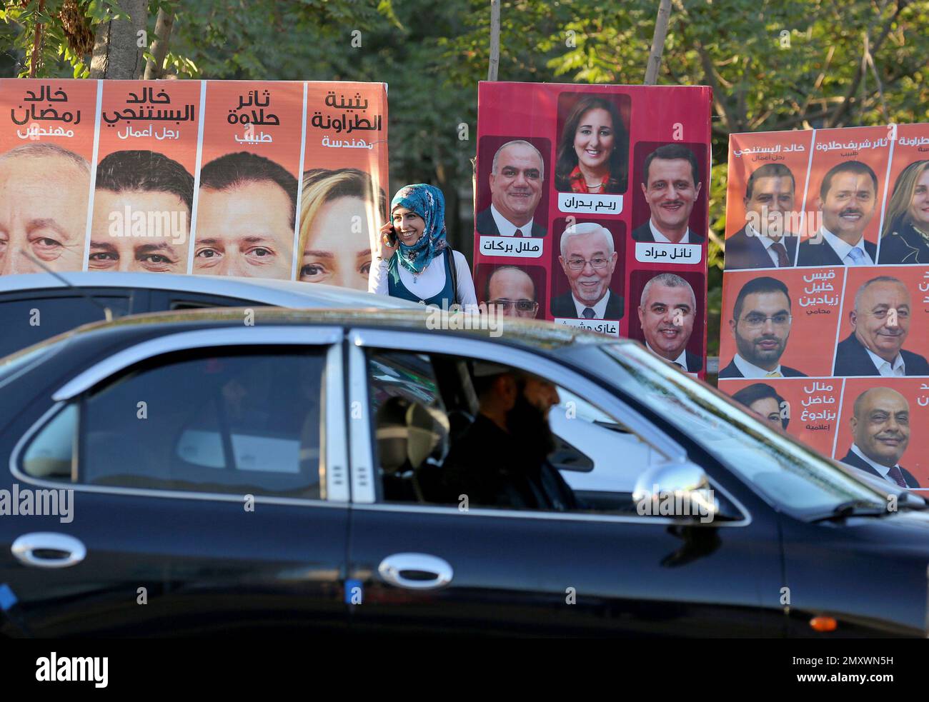 Election posters are on display in the capital, Amman, Jordan, Sunday ...