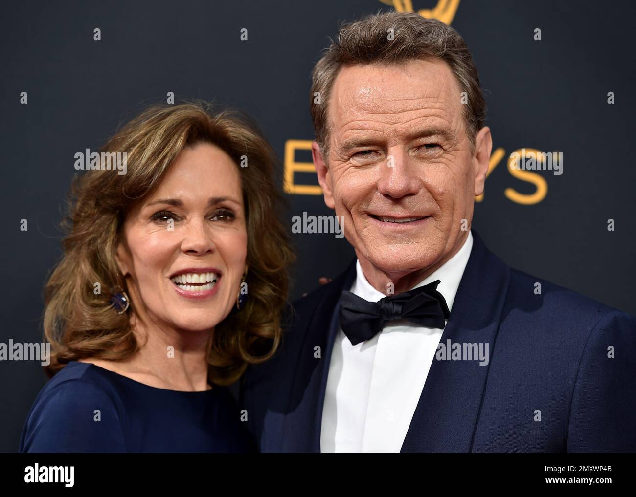 Robin Dearden, left, and Bryan Cranston arrive at the 68th Primetime ...