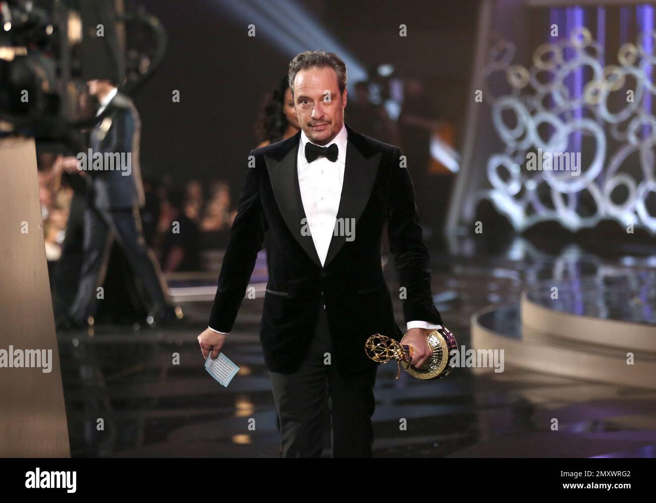 D.V. DeVincentis accepts the award for outstanding writing for a ...