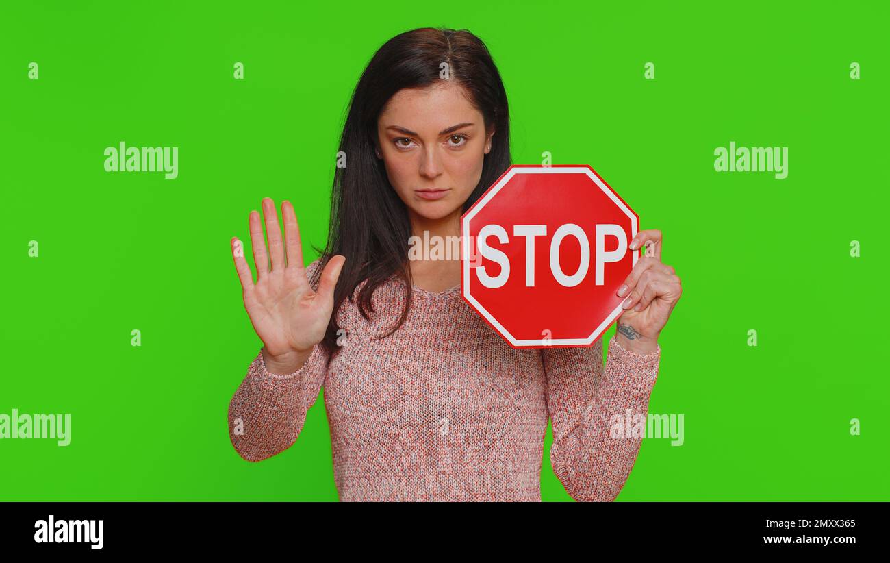 Serious pretty woman say No, hold inscription text red No stop danger ...