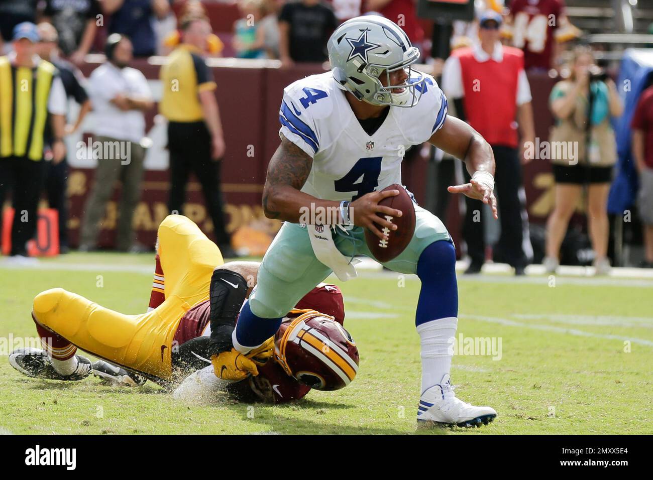 Washington Redskins defensive end Trent Murphy, left, hangs onto Dallas ...