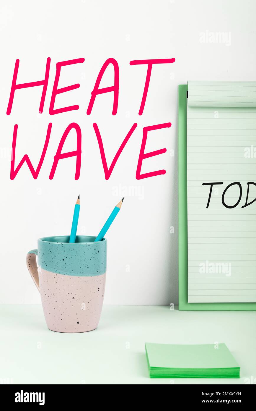 Hand writing sign Heat Wave. Word Written on a prolonged period of ...