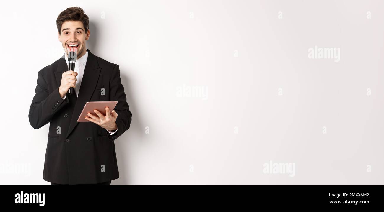 Image of handsome male performer, giving a speech, entertain people at ...