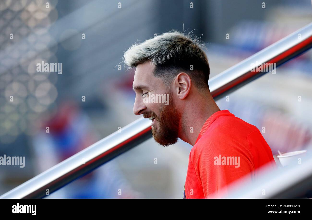 FC Barcelona's Lionel Messi smiles during a training session at the ...