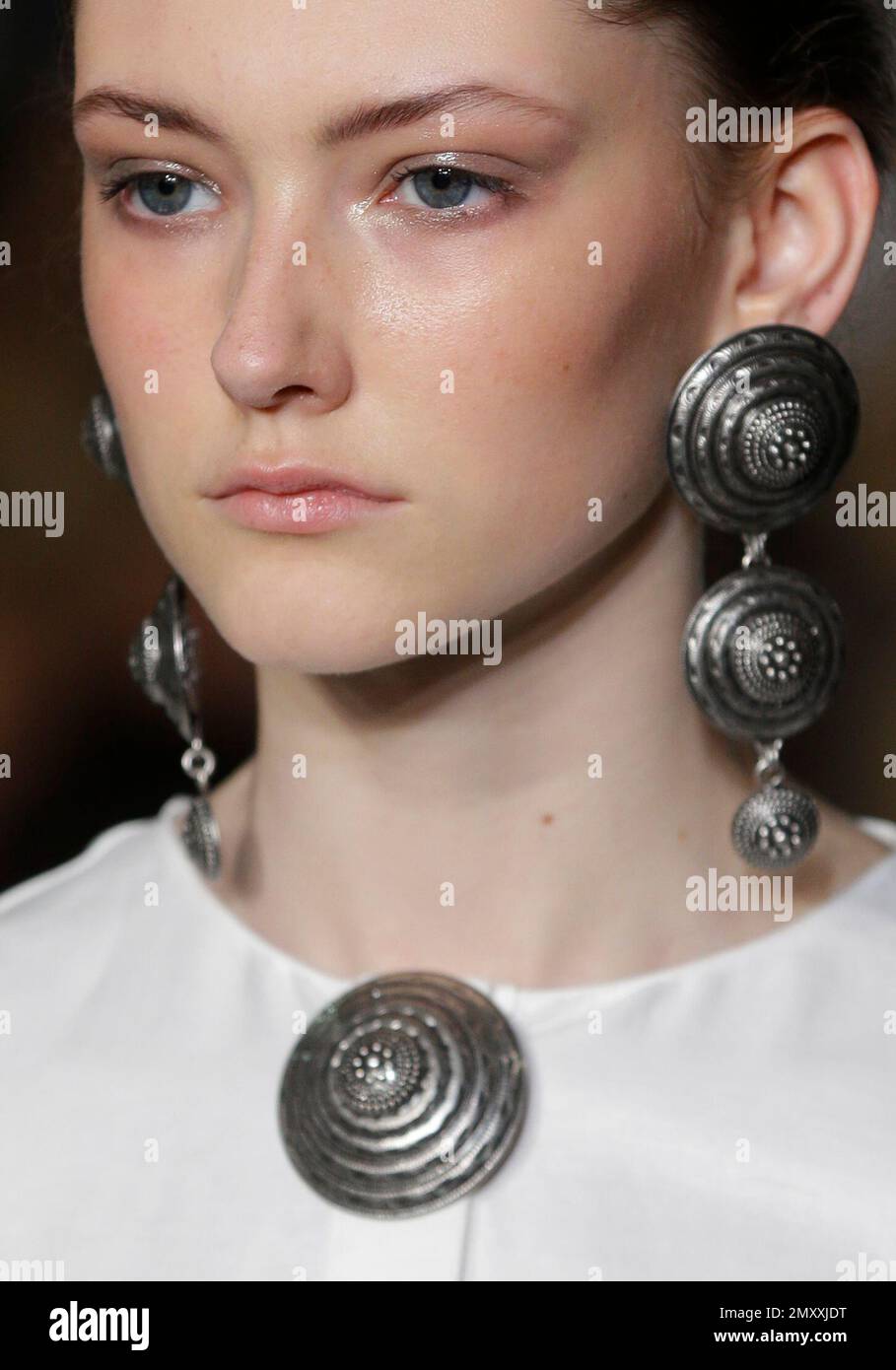 A model wears a creation by designer DAKS during their Spring/Summer ...