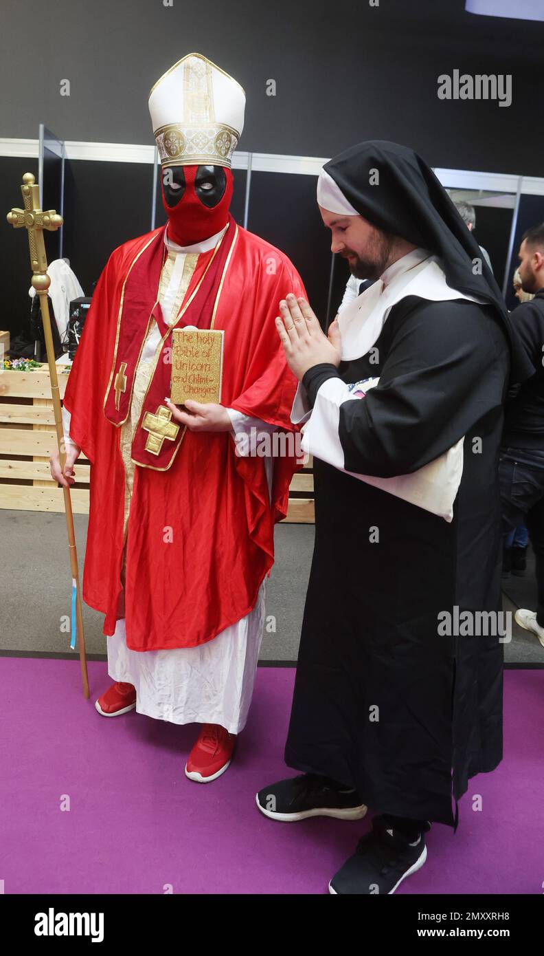 Erfurt, Germany. 04th Feb, 2023. Two visitors pose dressed as Pope with ...