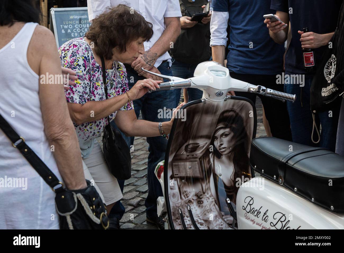 Janis Winehouse, mother of Amy Winehouse, signs a scooter with her ...