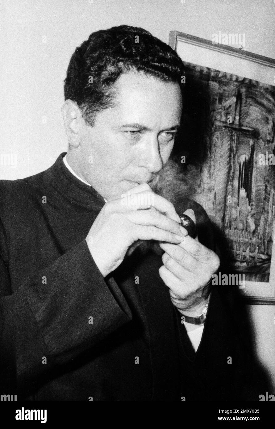 Father Camilo Torres of Colomibia smokes his pipe, date unknown. (AP ...